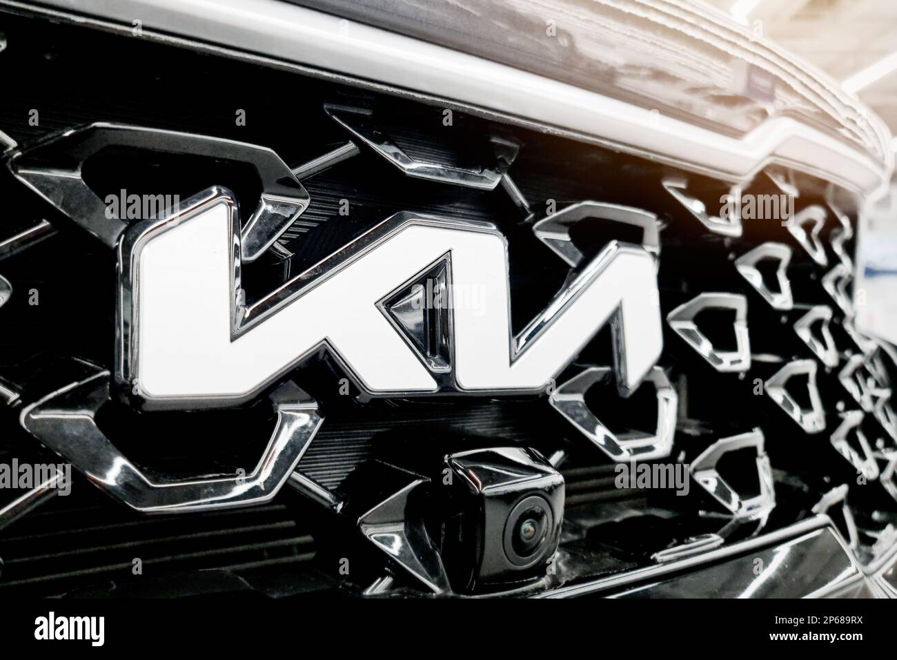 Kia logo on the grille of a new car Stock Photo - Alamy