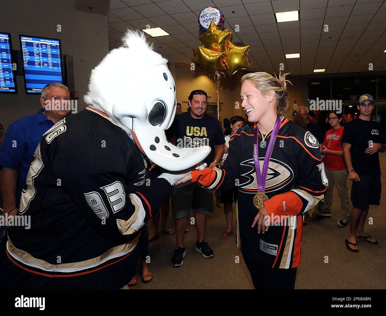 Water polo gold medalist Courtney Mathewson is greeted by Anaheim Ducks ...