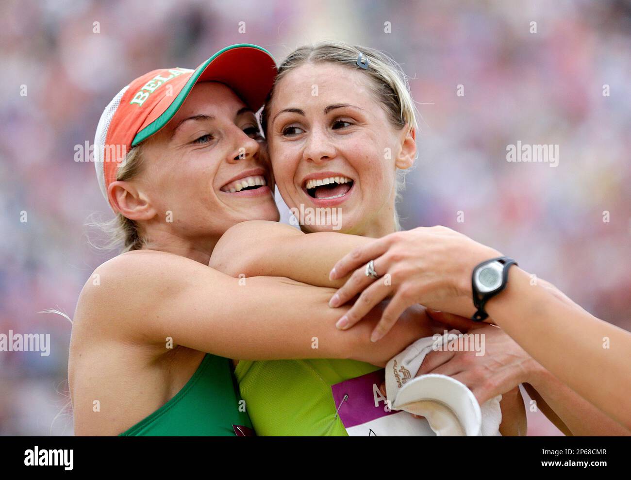 Laura Asadauskaite, of Lithuania, right, is embraced by Anastasiya ...