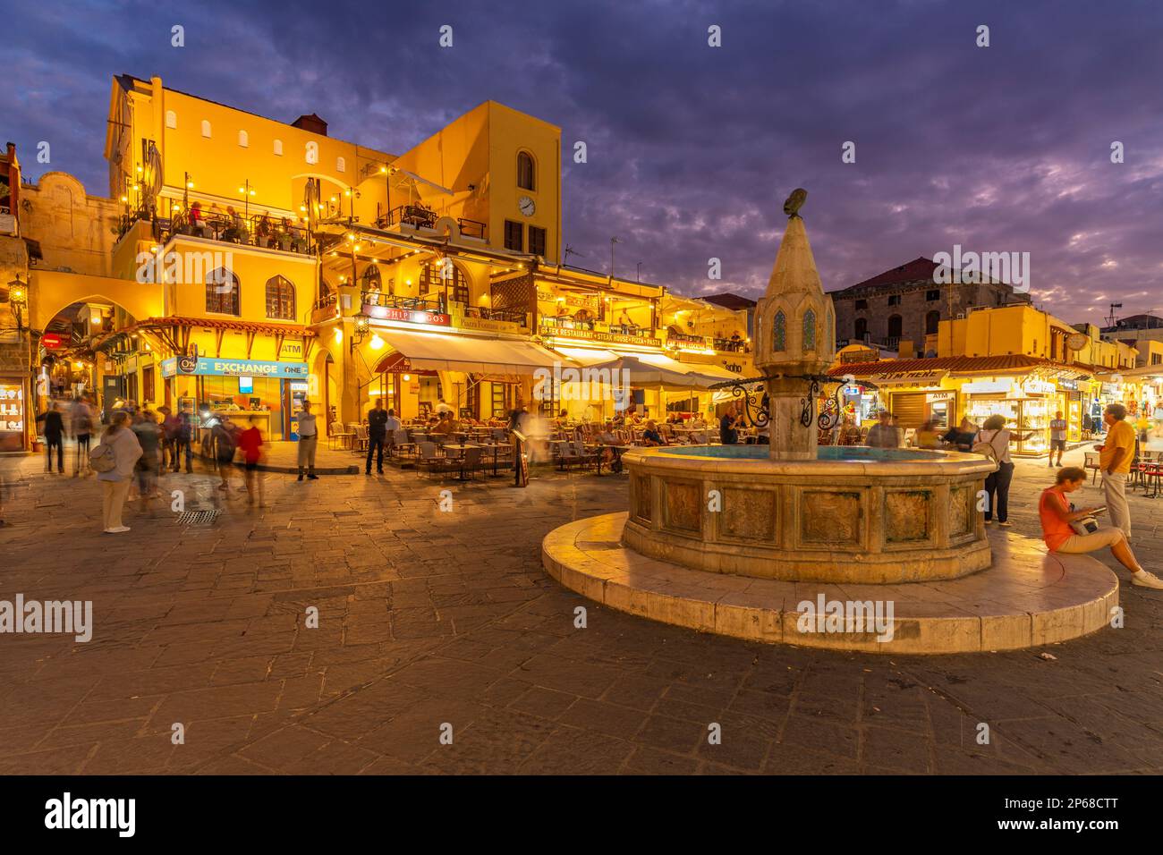View of fountain in Hippocrates Square at dusk, Old Rhodes Town, UNESCO ...