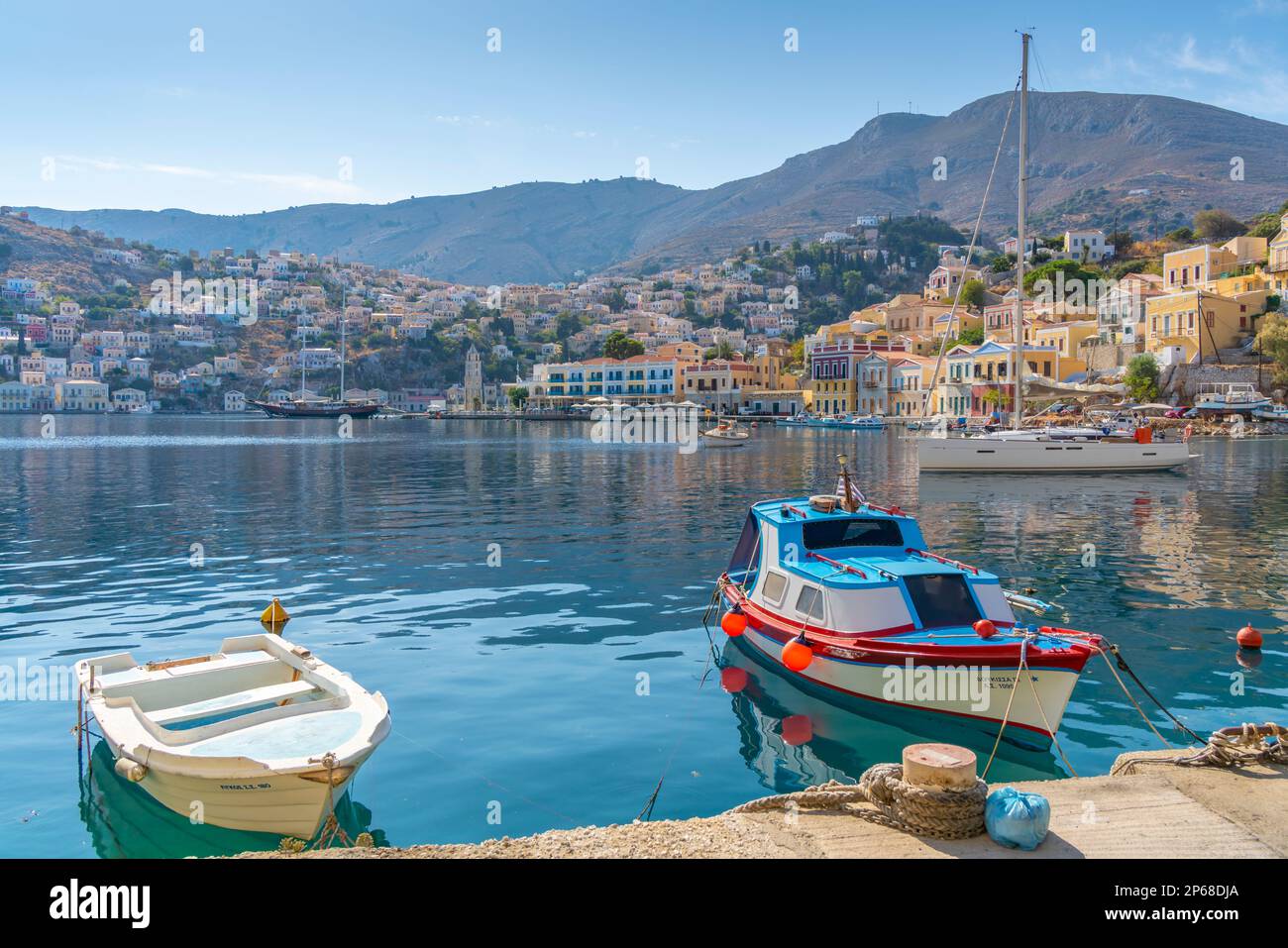 View of boats in harbour of Symi Town, Symi Island, Dodecanese, Greek ...