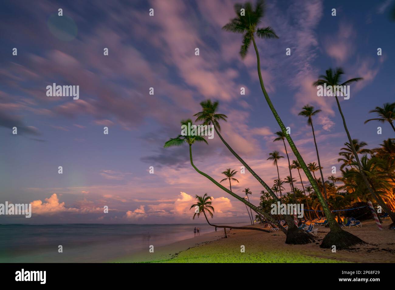 View of palm trees and sea at Bavaro Beach at sunset, Punta Cana ...