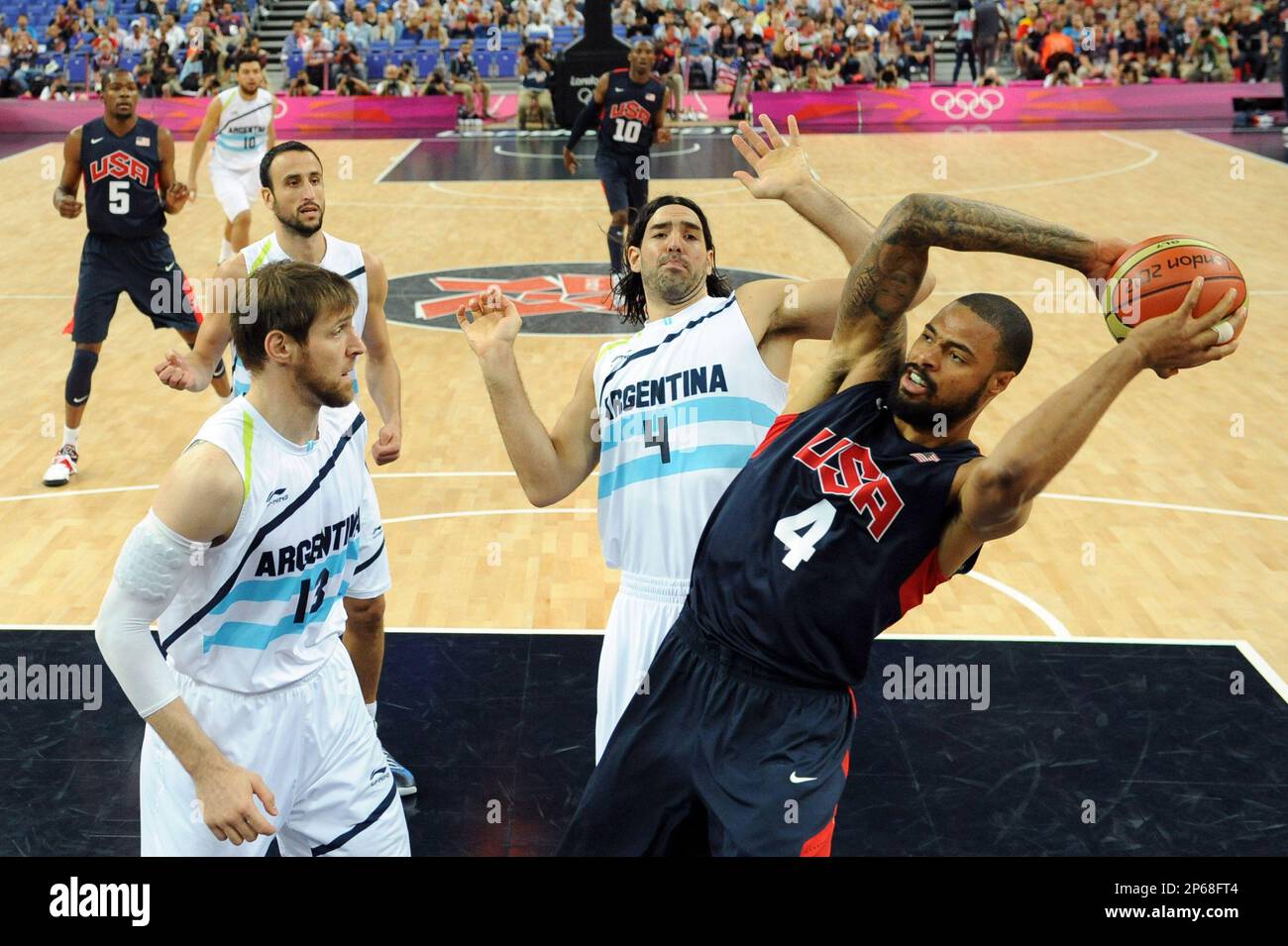 Argentina's forward Andres Nocioni, left, and Luis Scola, center ...