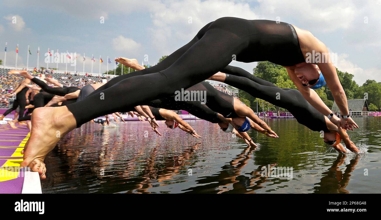 Ukrainian swimmer Igor Chervynskiy and other swimmers dive in to start ...