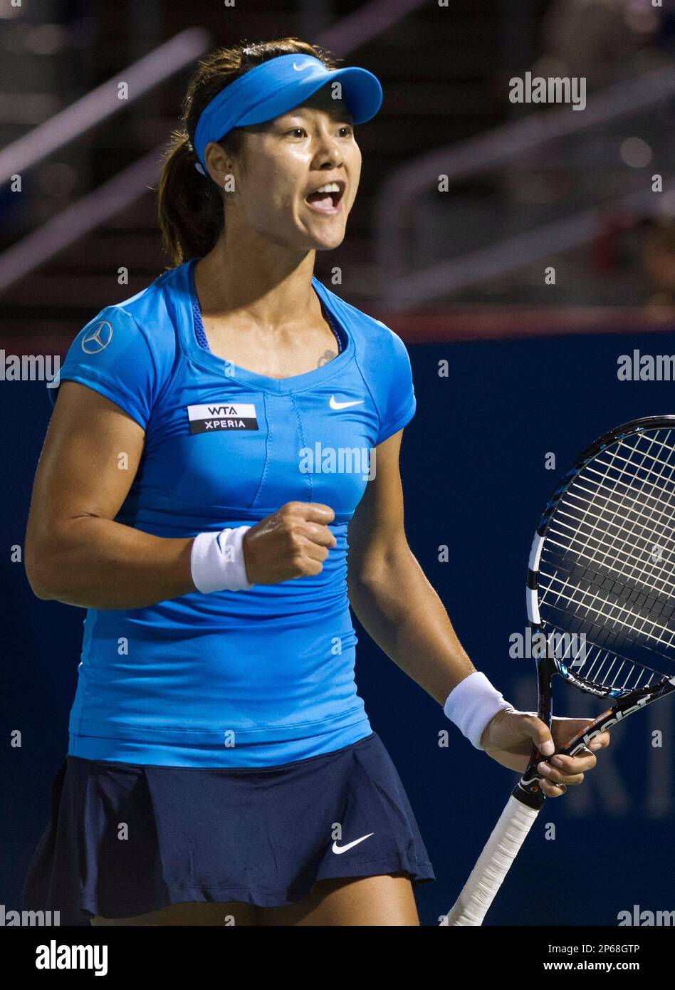 Li Na, from China, celebrates a point against Canada's Eugenie Bouchard ...