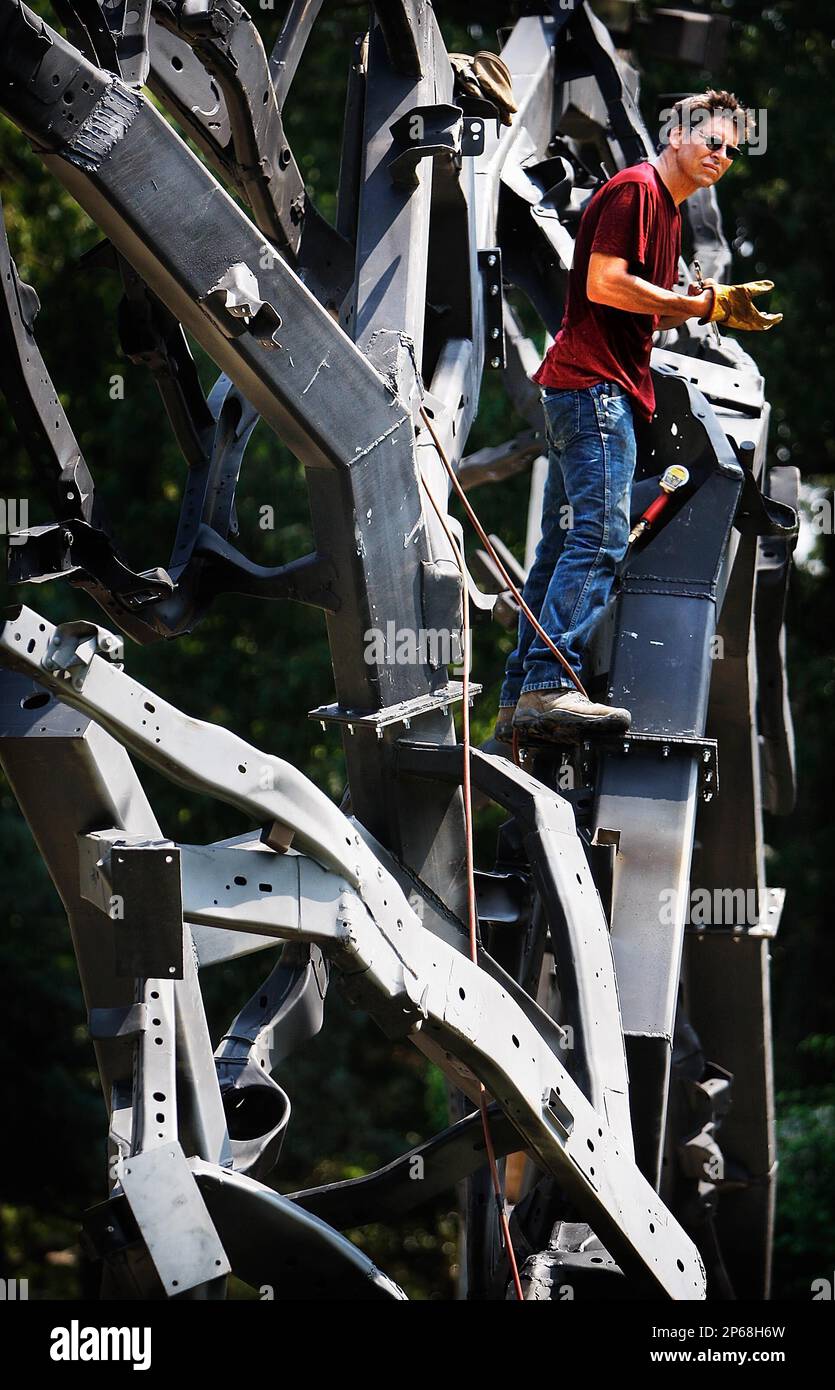 Artist Chris Fennell installs a giant guitar sculpture made from truck ...