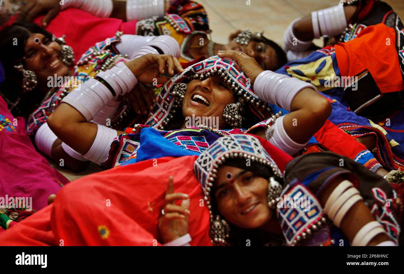 Indian Lambadi tribal women rest before performing during World Tribal ...