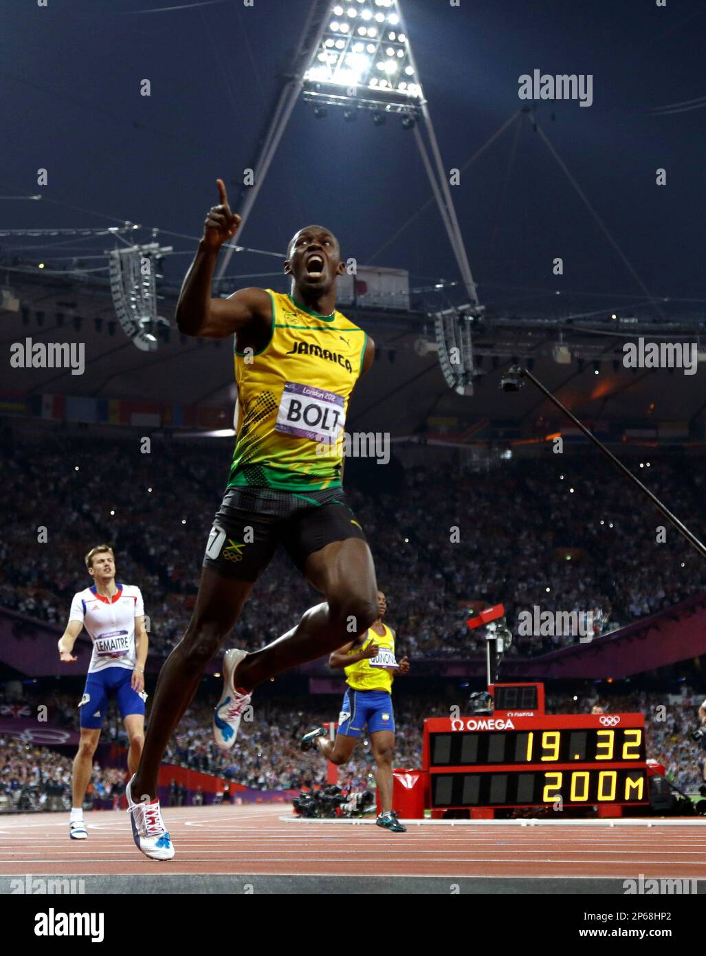 Jamaica's Usain Bolt celebrates his gold medal win in the men's 200 ...