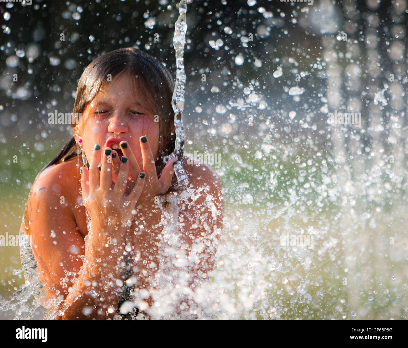 Skylar Rogers, 10, finds a splash of cool water at Borah Pool Tuesday ...
