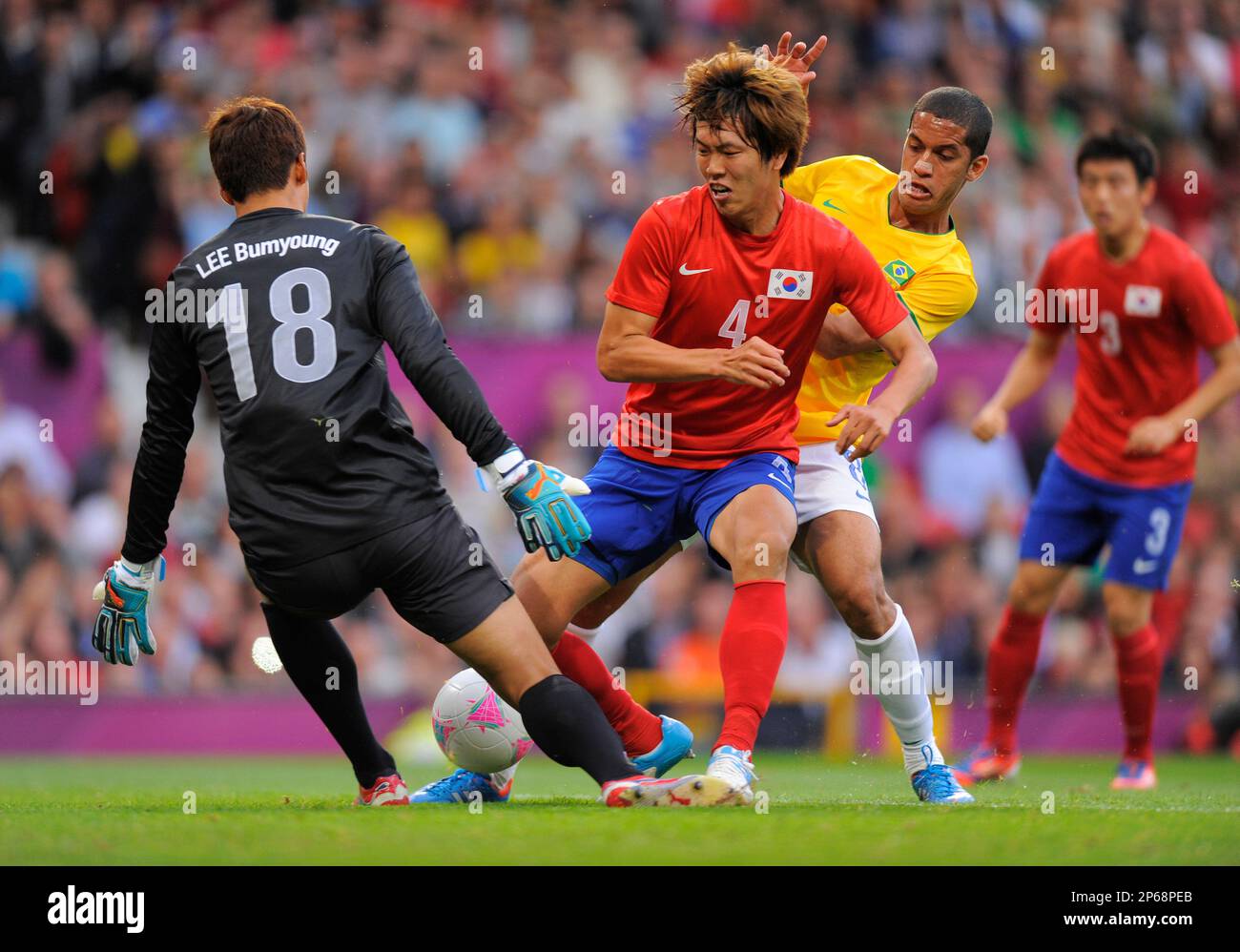 Brazil's Romulo tries to get in-between South Korea's Lee Bum-young and ...
