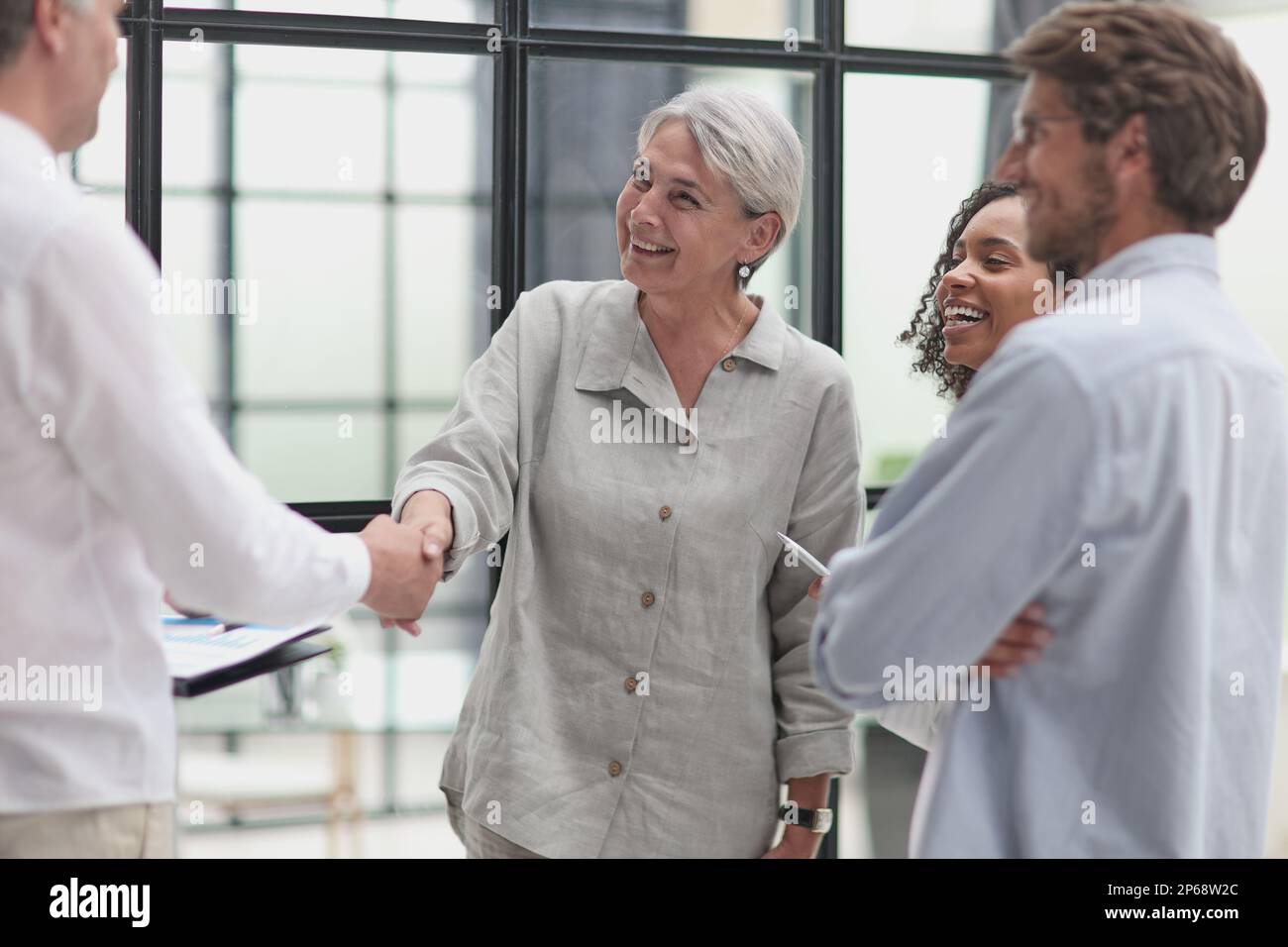 Conversation between managers and employees in the office Stock Photo ...