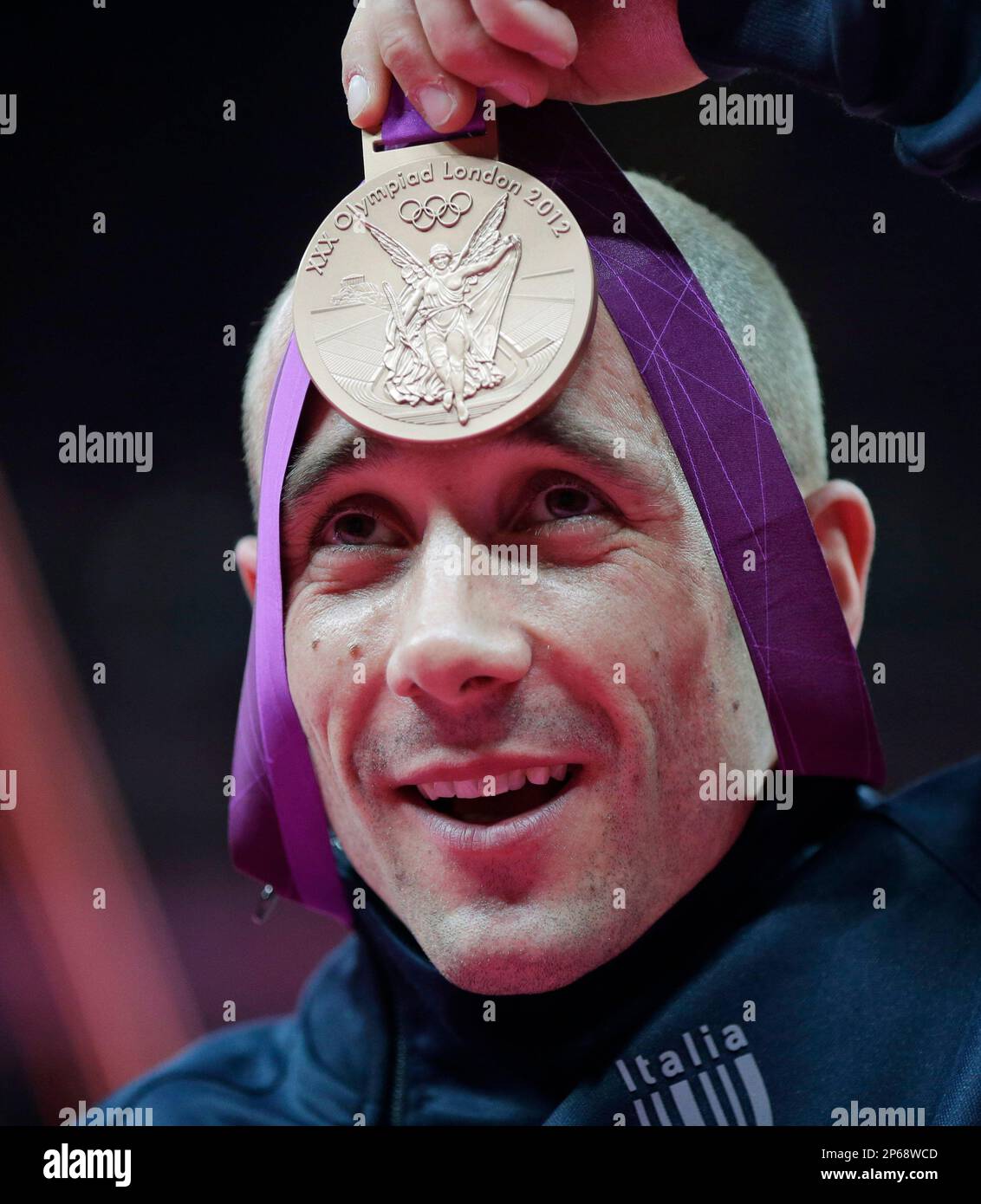 Bronze medallist Italy's Matteo Morandi displays his medal for the ...