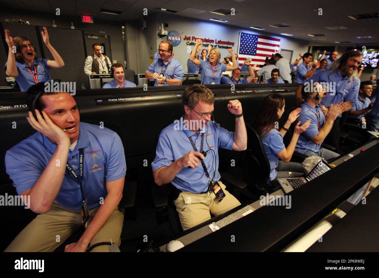 Peter Ilott, center, and his colleagues celebrate a successful landing ...
