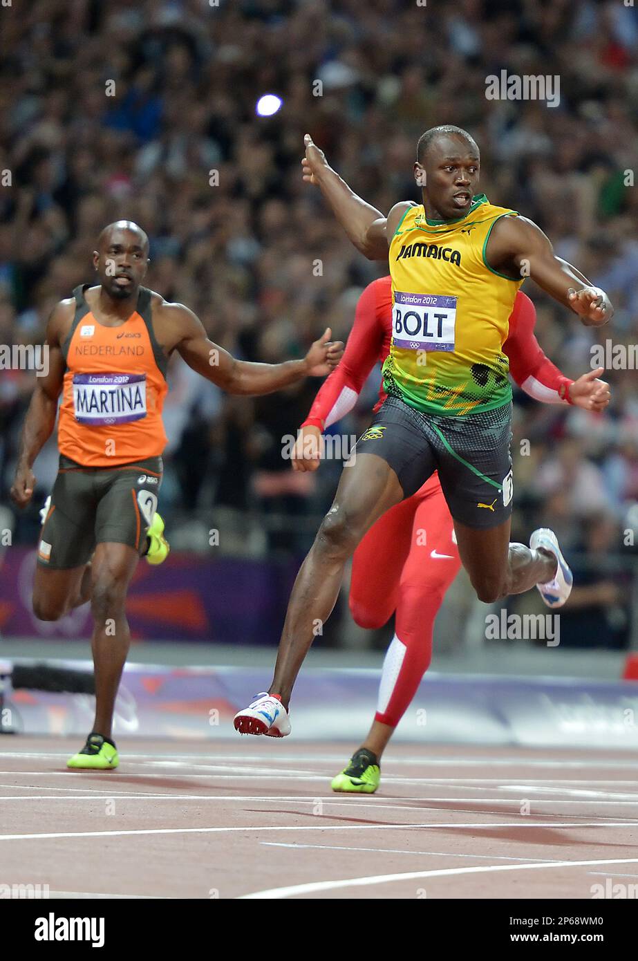 Jamaica's Usain Bolt (third left) crosses the line to win the Men's ...