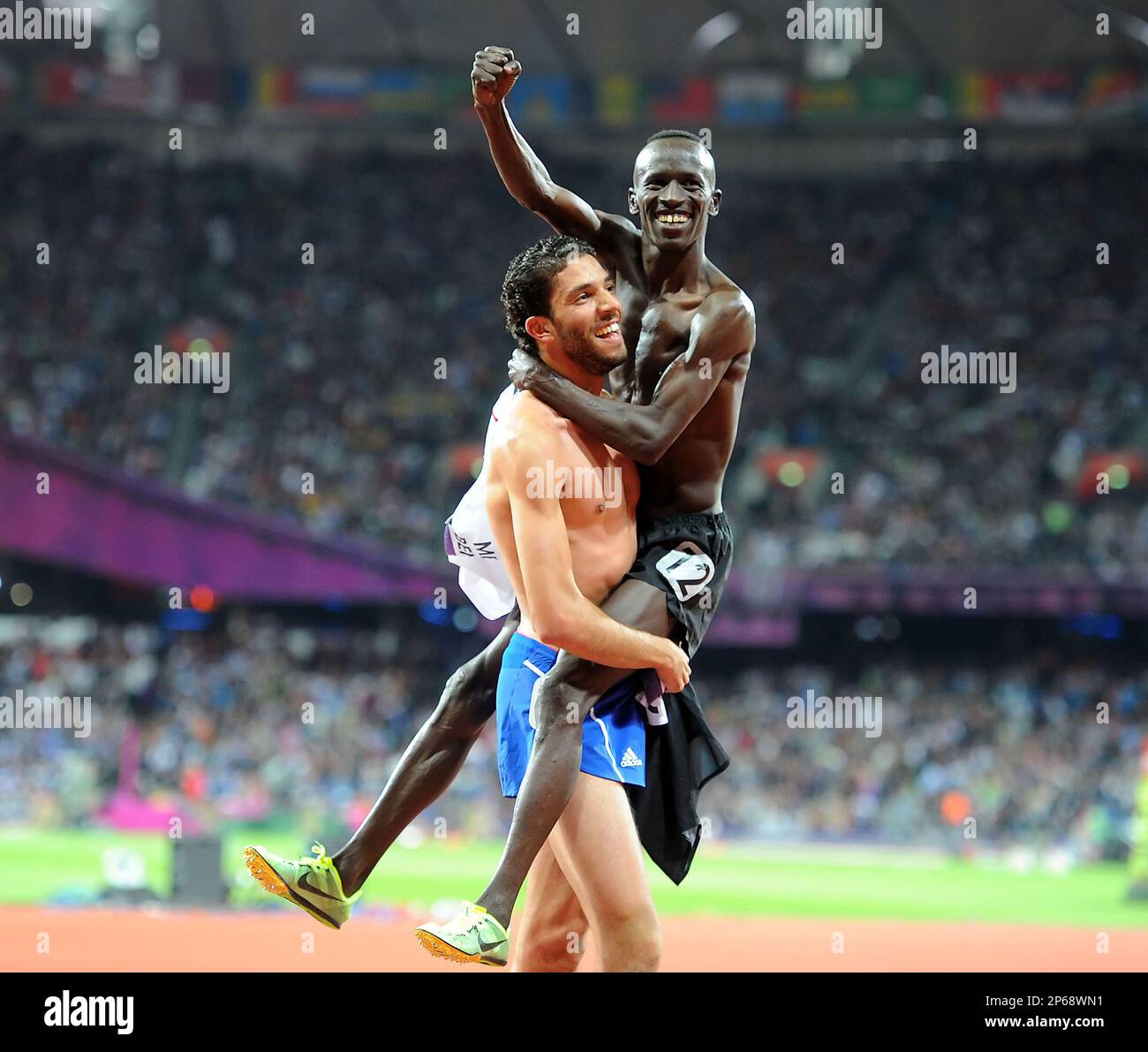 Kenyan Athlete Ezekiel Kemboi celebrates winning gold with France's ...