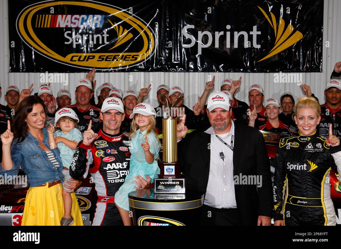 Jeff Gordon and his family and crew celebrate in victory lane after winning the NASCAR Sprint ...