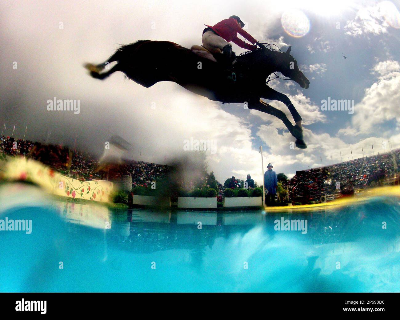 In this photo made using a fisheye lens, Jaime Azcarraga, of Mexico ...