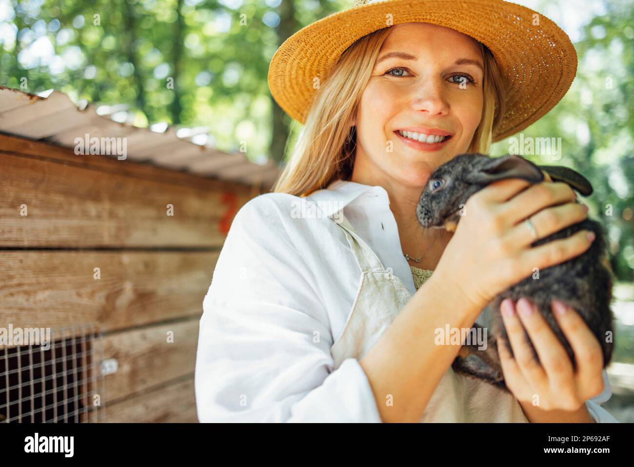 Woman holding rabbit close face hi-res stock photography and images - Alamy