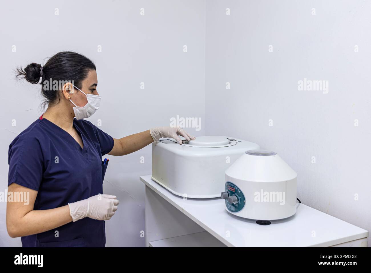 The blood tube is removed from the medical centrifuge for plasma ...