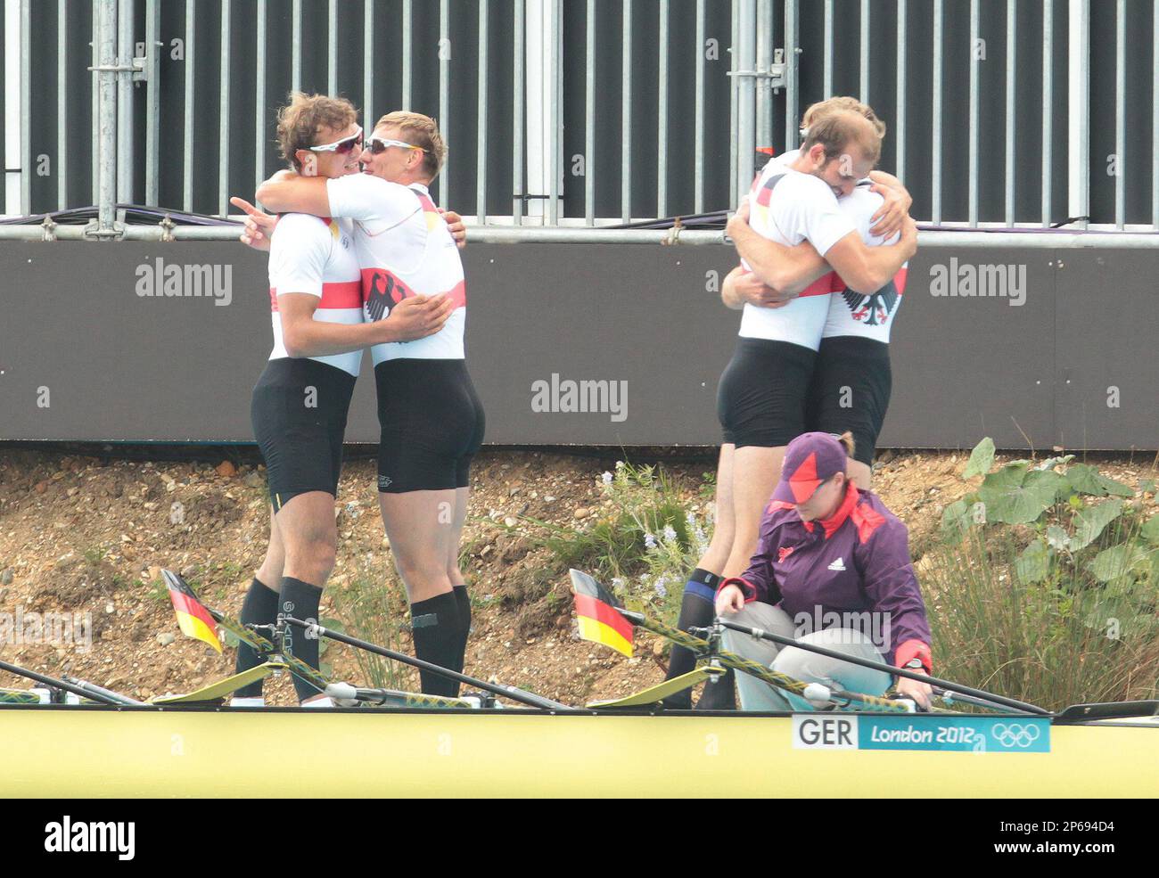 The German sculling team celebrates winning a gold medal in the Men's ...