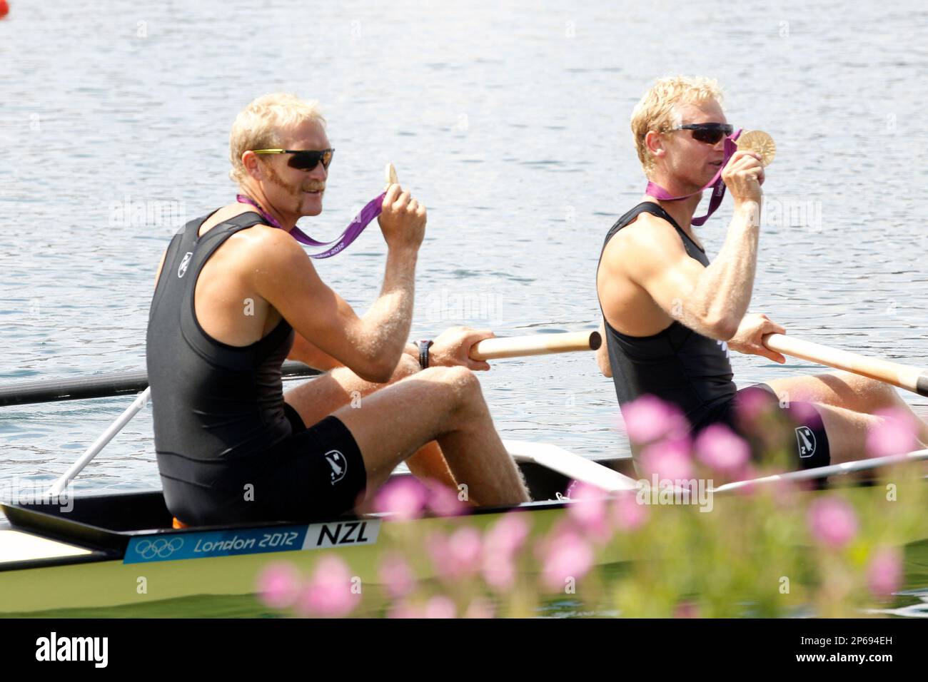 Hamish Bond (left) and Eric Murray (right) display their gold medals ...