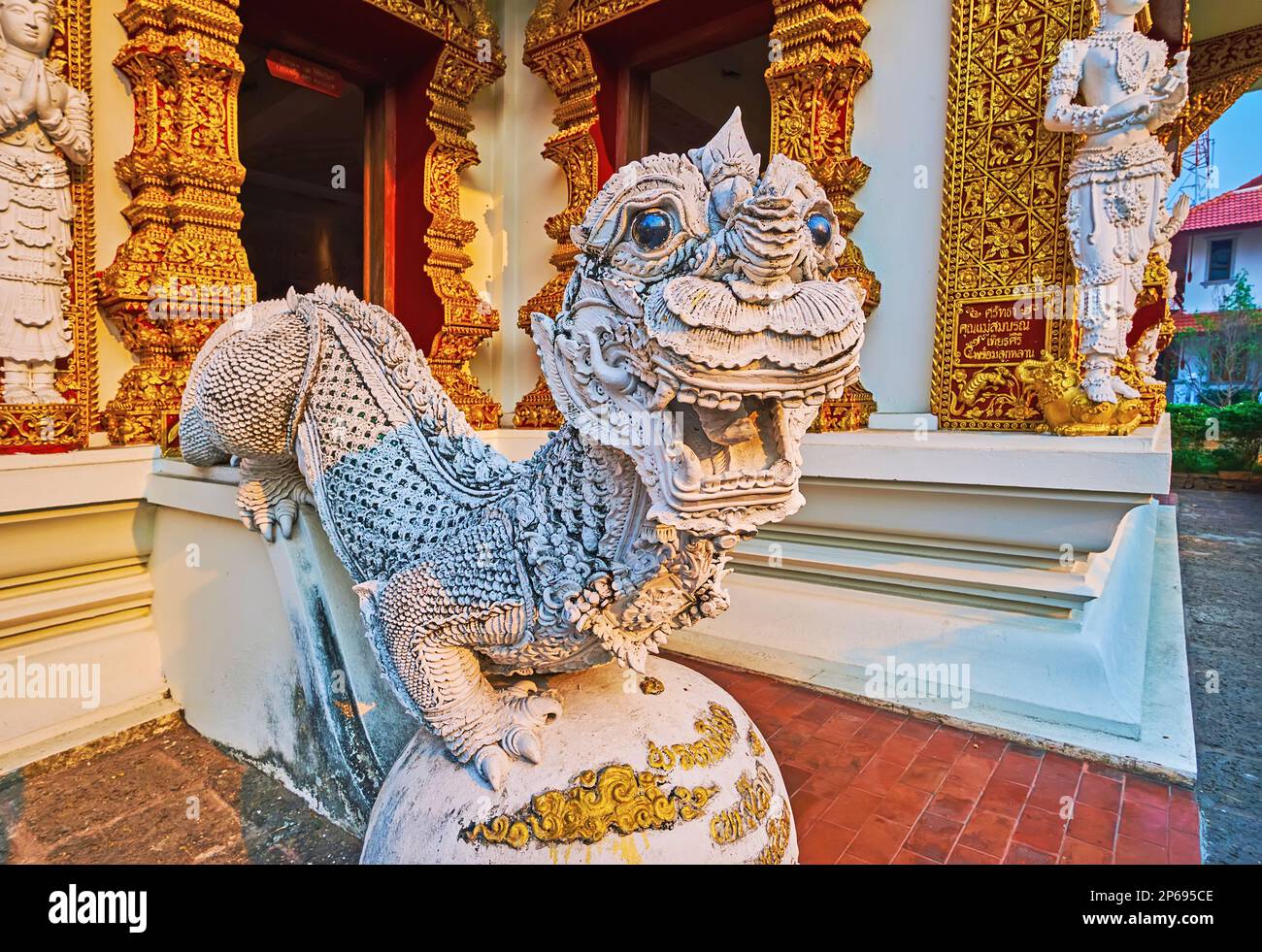 The statue of Mom aquatic creature at the entrance to the Wat Buppharam ...
