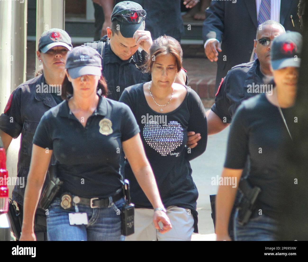 Law enforcement officers with Putnam County lead Andrea Sneiderman from ...