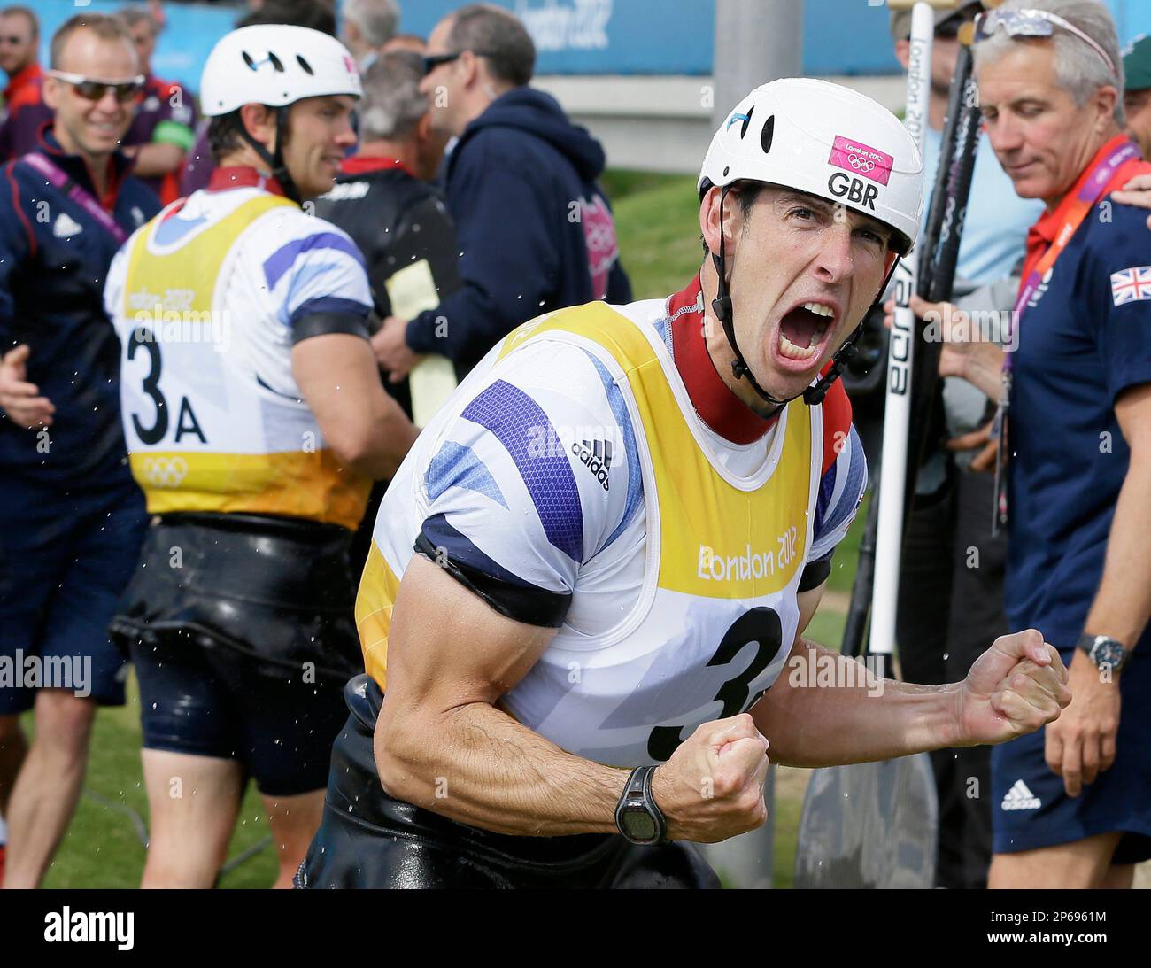 Gold medal winner Etienne Stott of Britain celebrates, with his partner ...