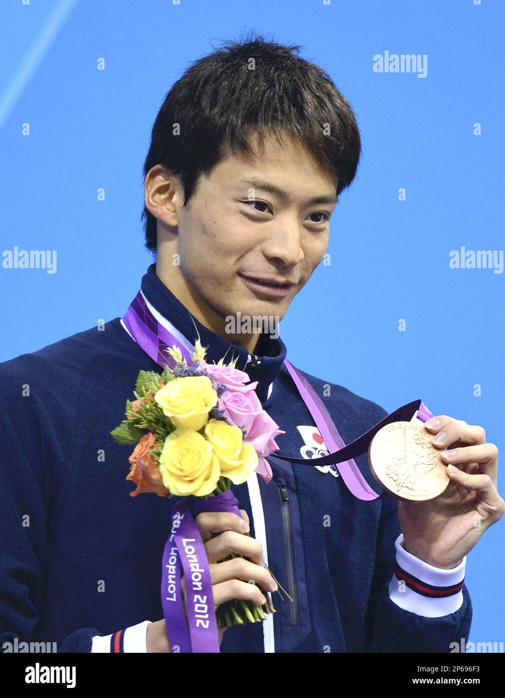 Ryousuke Irie of Japan celebrates after receiving the bronze medal at ...