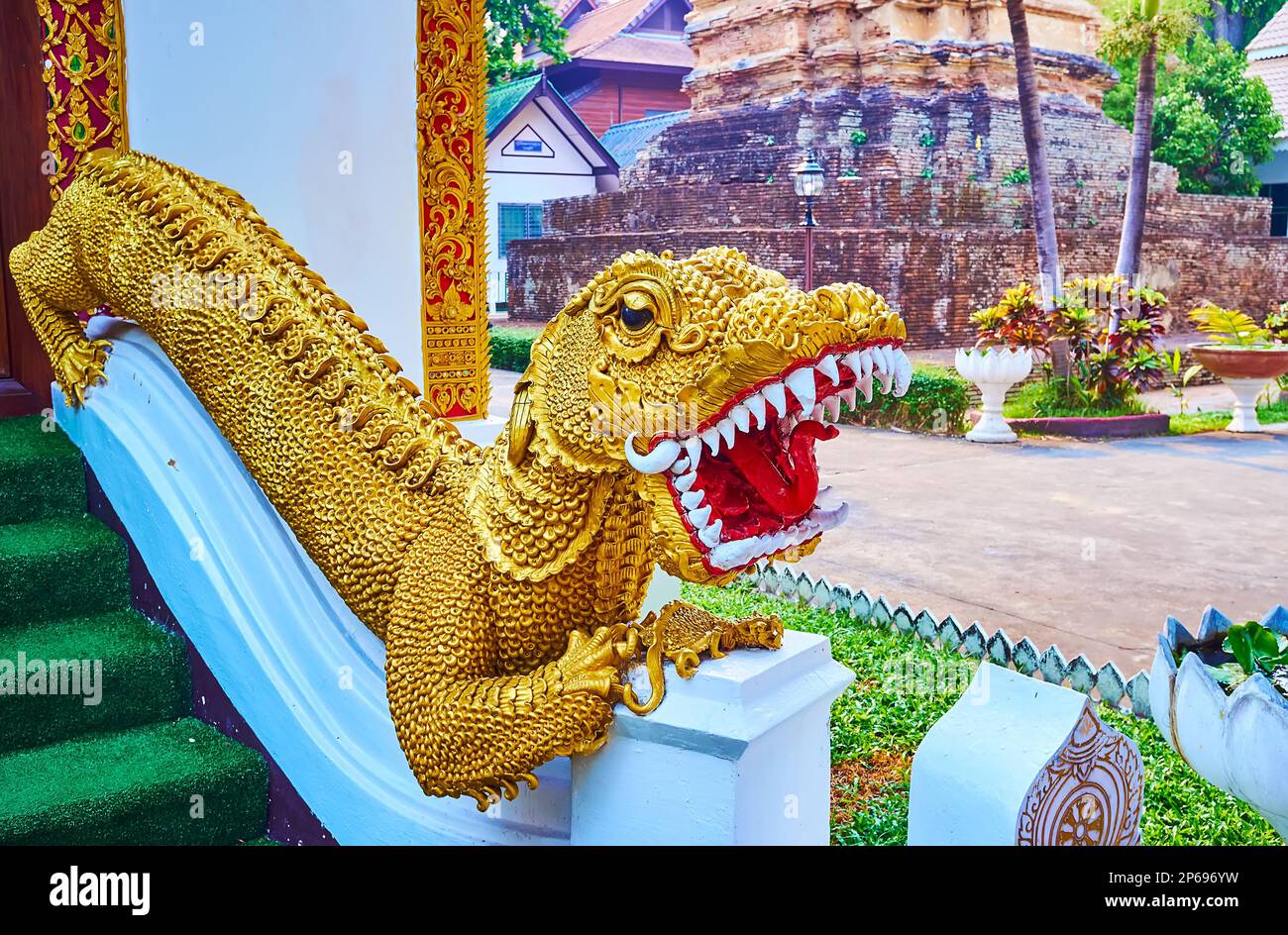 The gilt Mom statue with big jaws and teeth, Wat Umong Mahathera Chan ...