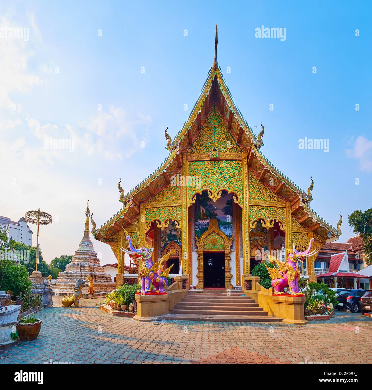 Exterior of Viharn of Wat Chetawan, decorated with two statues of ...