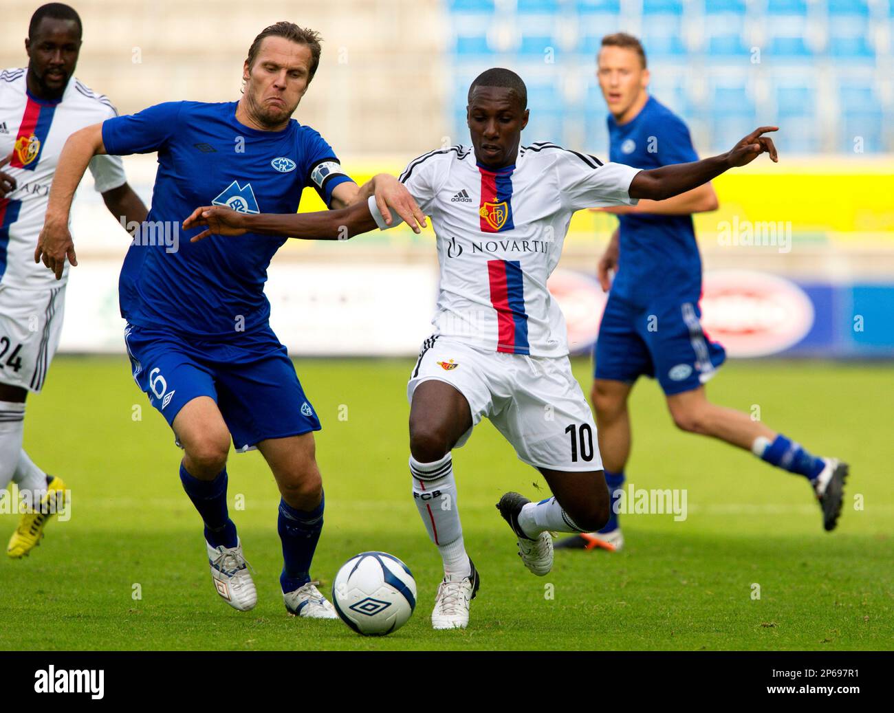 Molde's Daniel Berg Hestad (left) and Basel's Yapo Gilles Donald Yapi ...