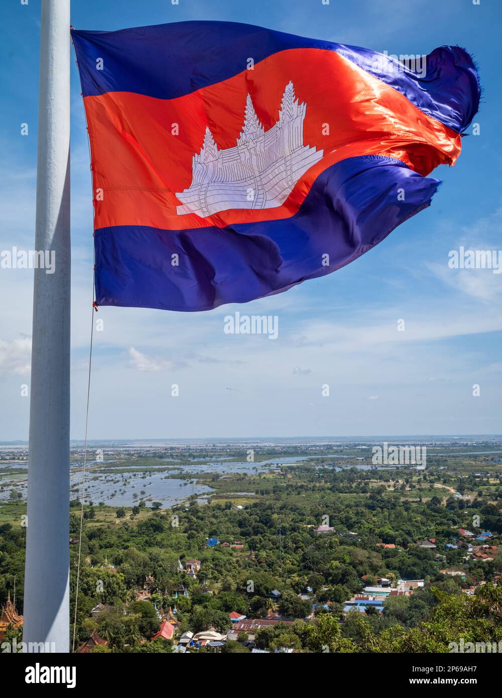 The Cambodian flag flies at the top of Oudong Temple which overlooks ...