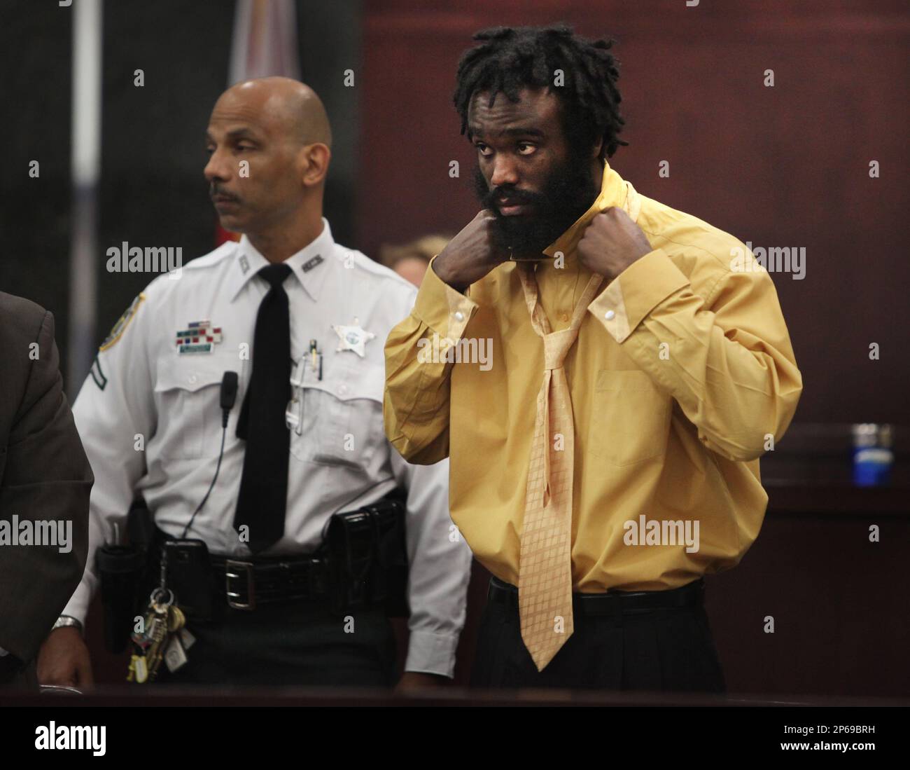 Dontae Morris fixes his tie before potential jurors are brought in for ...