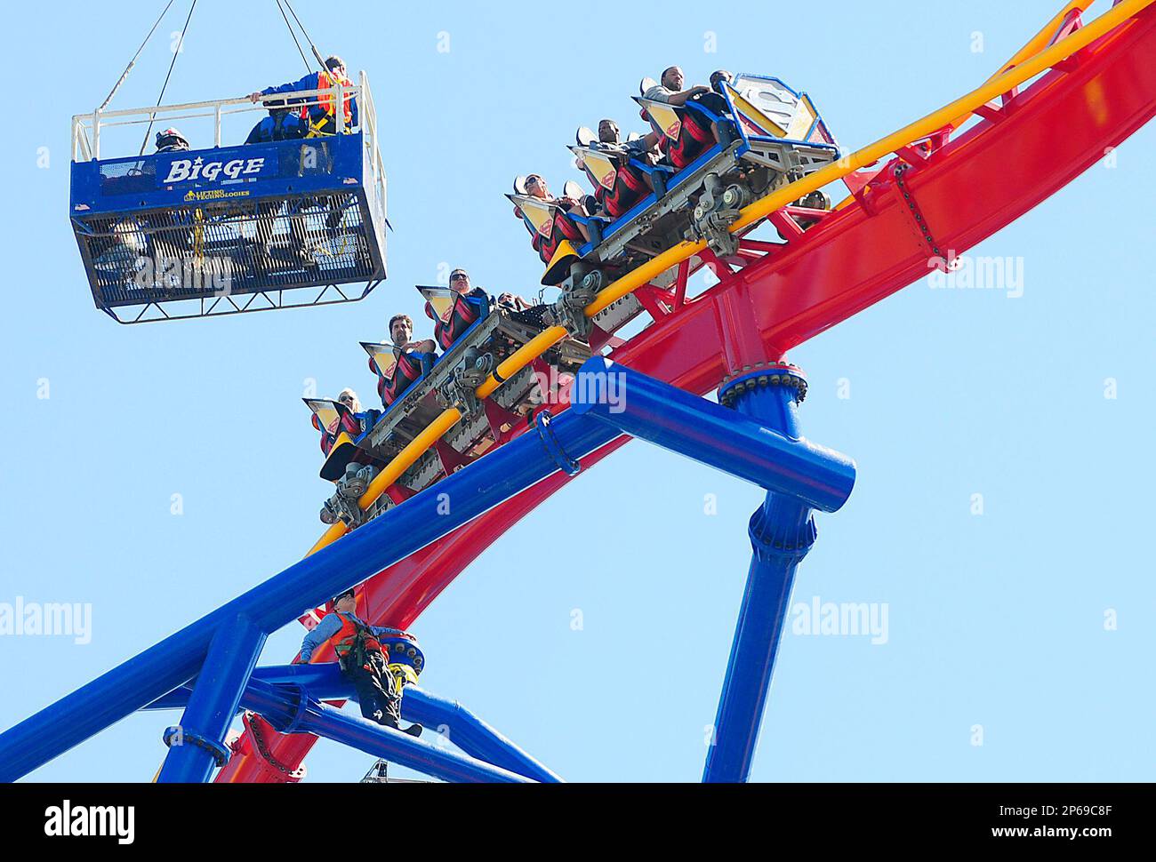 Emergency crews bring water to passengers stuck over 150 feet in the ...