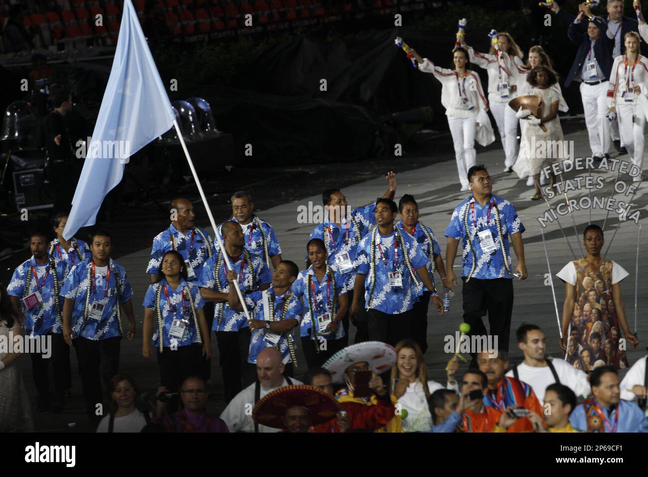 Athletes from Federated States of Micronesia enter the stadium led by ...