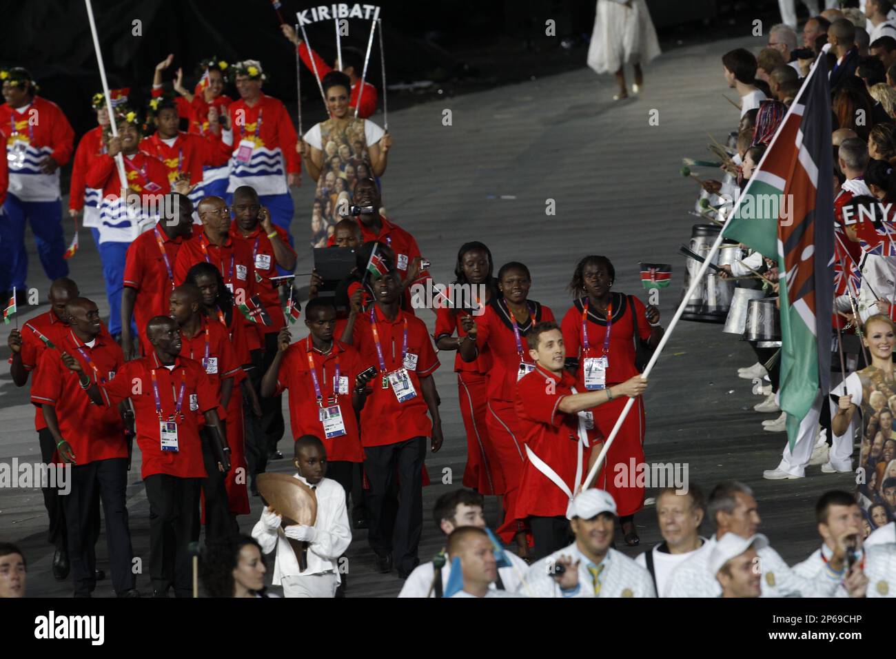 Athletes from Kenya enter the stadium led by flag bearer Jason Dunford ...