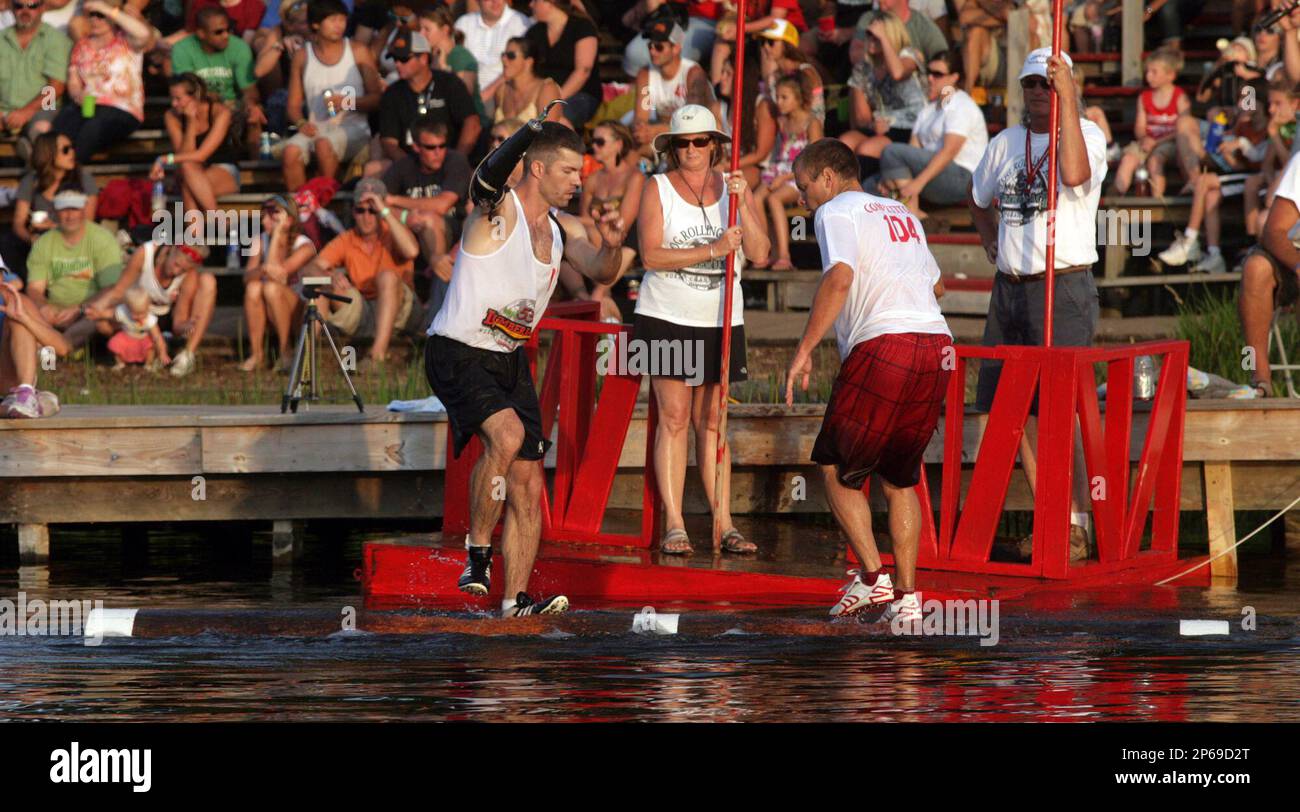 In this Saturday, July 28, 2012, photo, JR Salzman, left, of Menomonie ...