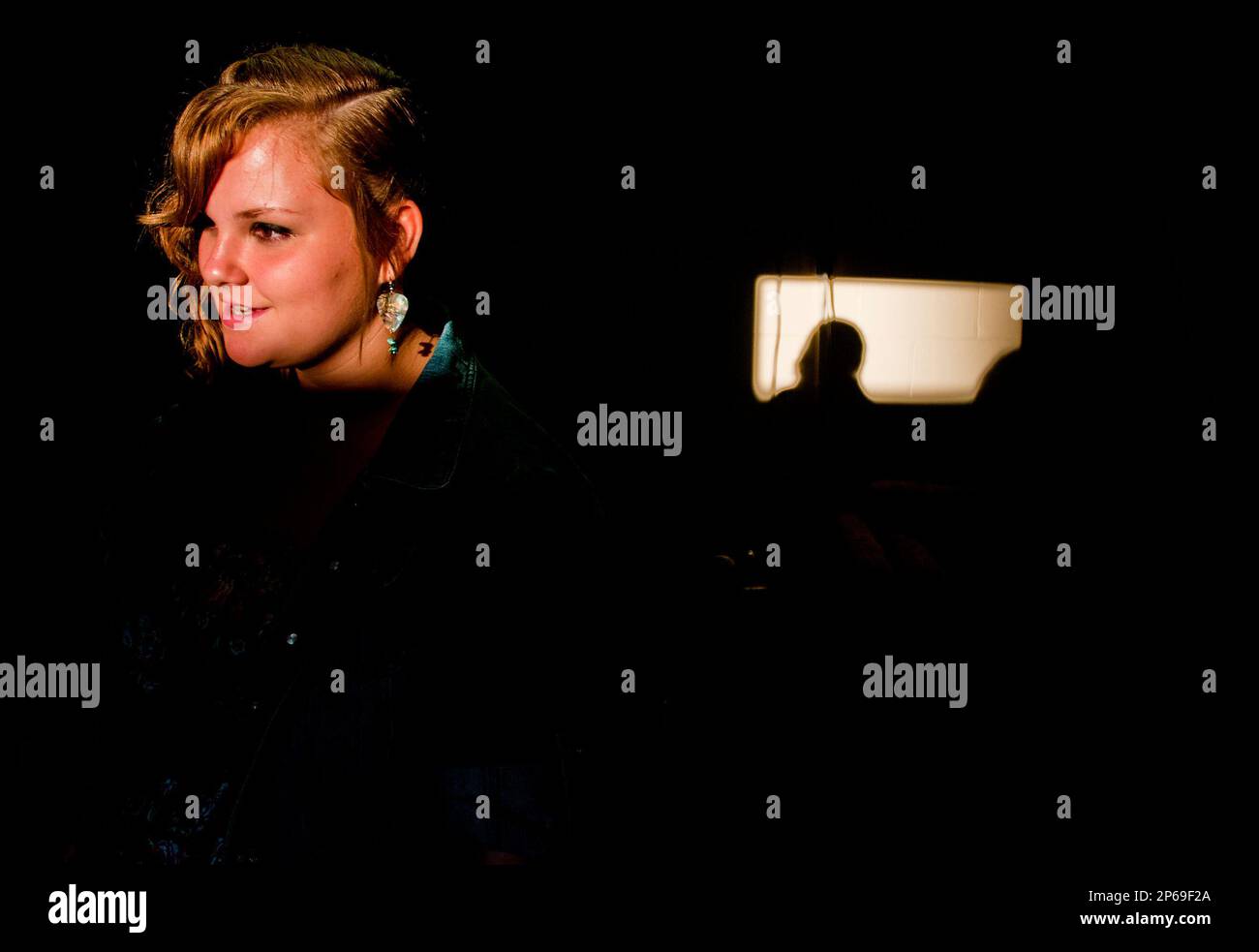 Emily Zender looks out at the stage from the girls' dressing room at ...