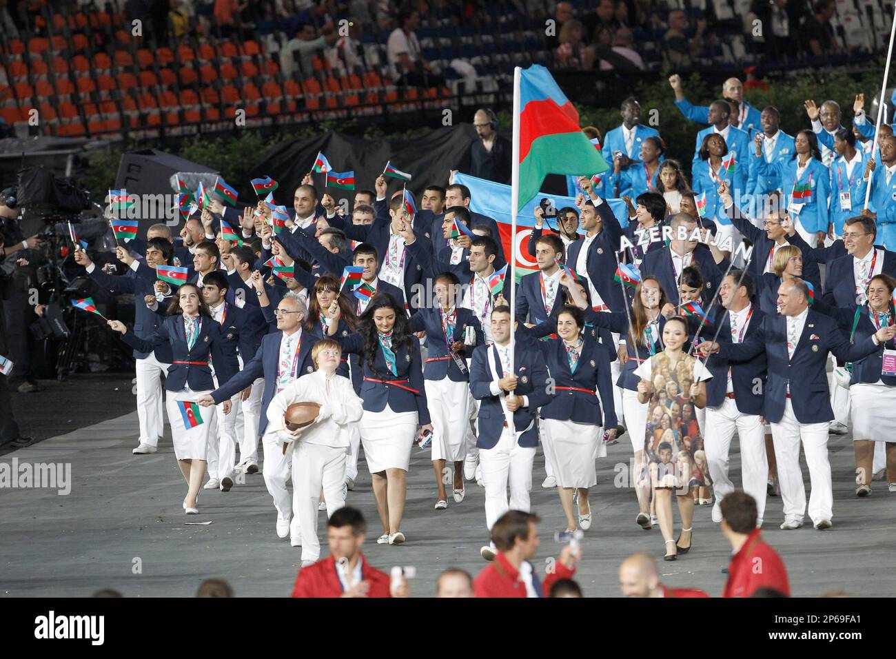 Athletes from Azerbaijan enter the stadium led by flag bearer Elnur ...