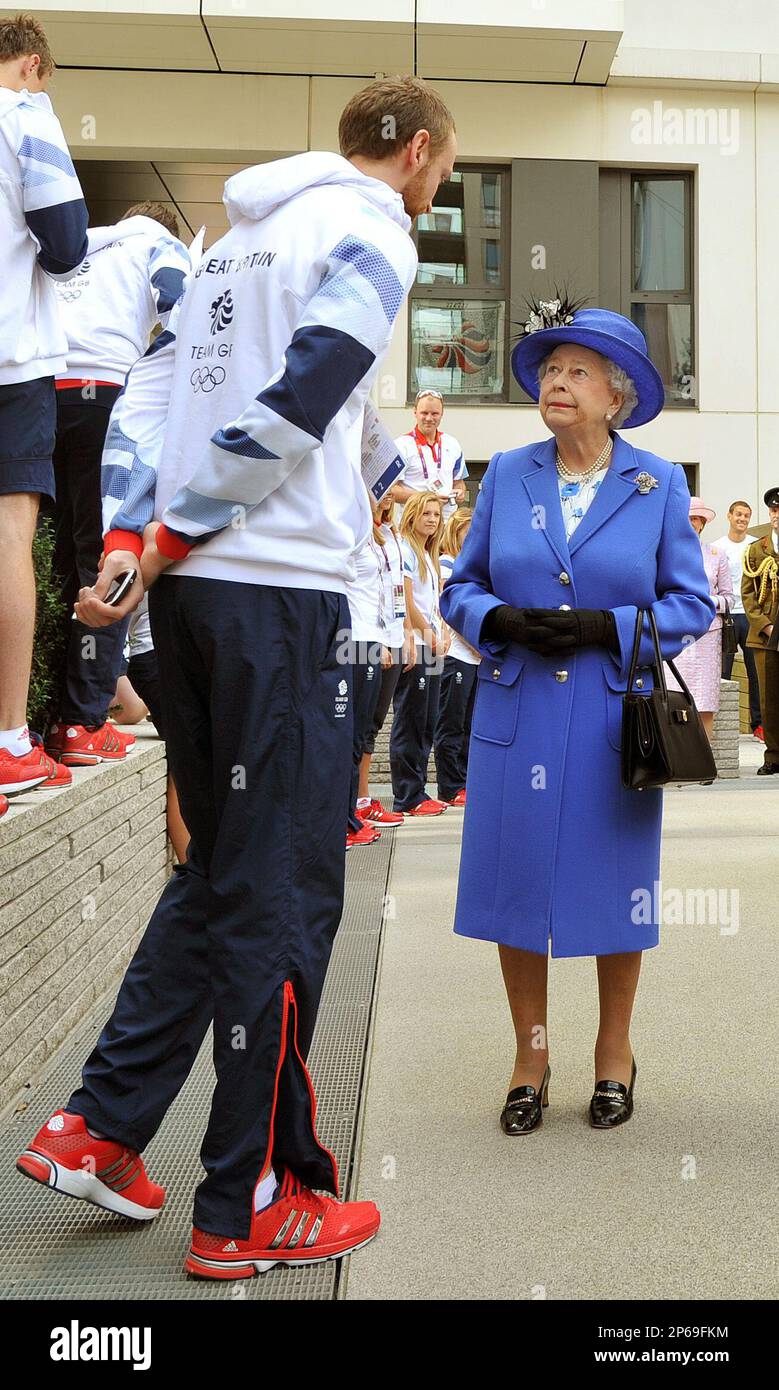 Queen Elizabeth II meets one of the taller members of the Great Britain ...