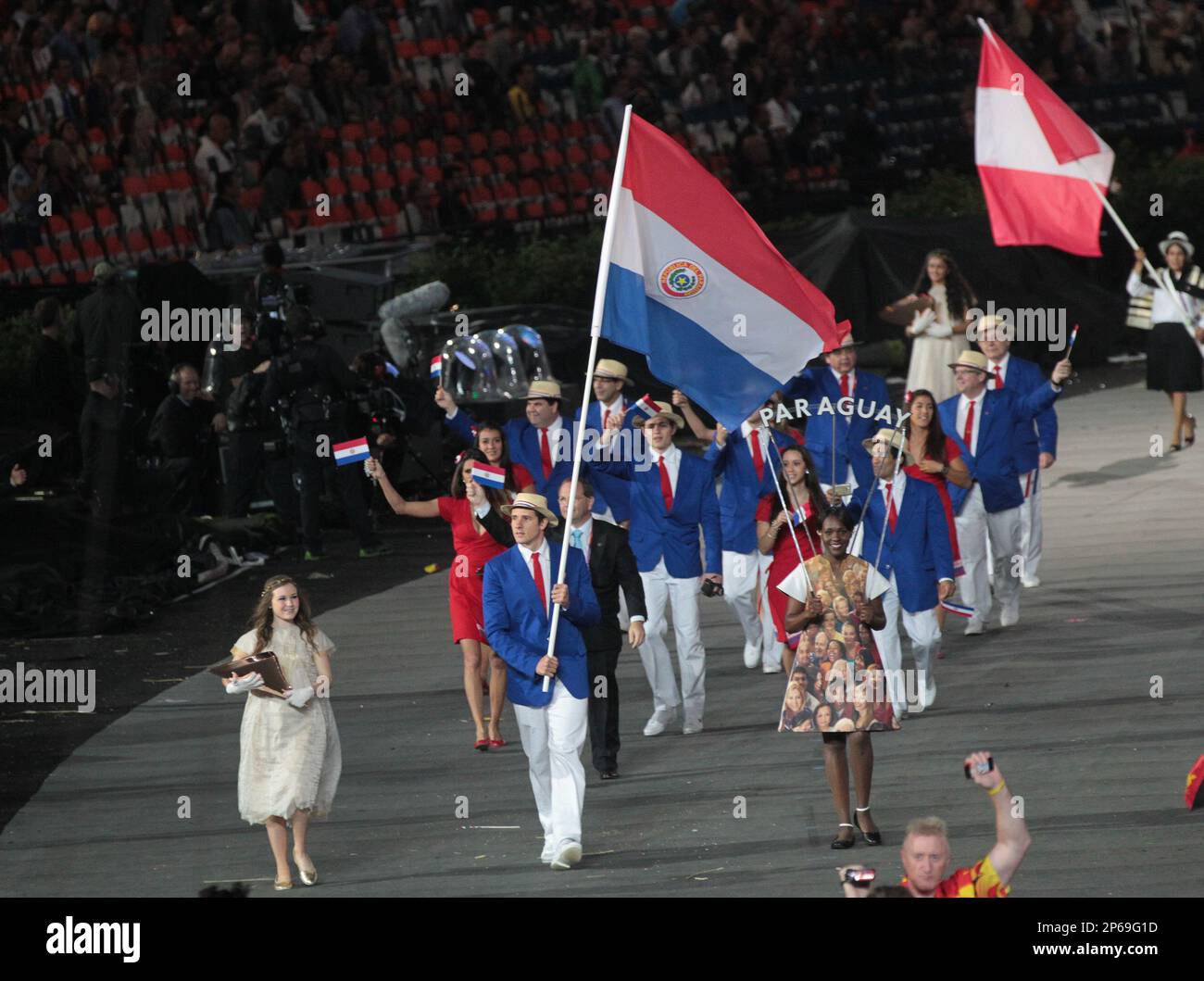 Athletes from Paraguay enter the stadium led by flag bearer Benjamin ...