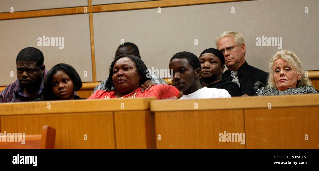 Alice Jordan, left of center, mother to Demetrius Jordan, is surrounded ...