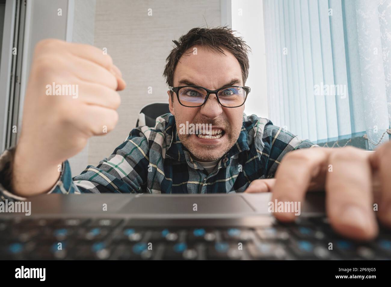 angry man swearing and cursing against information technology and his ...