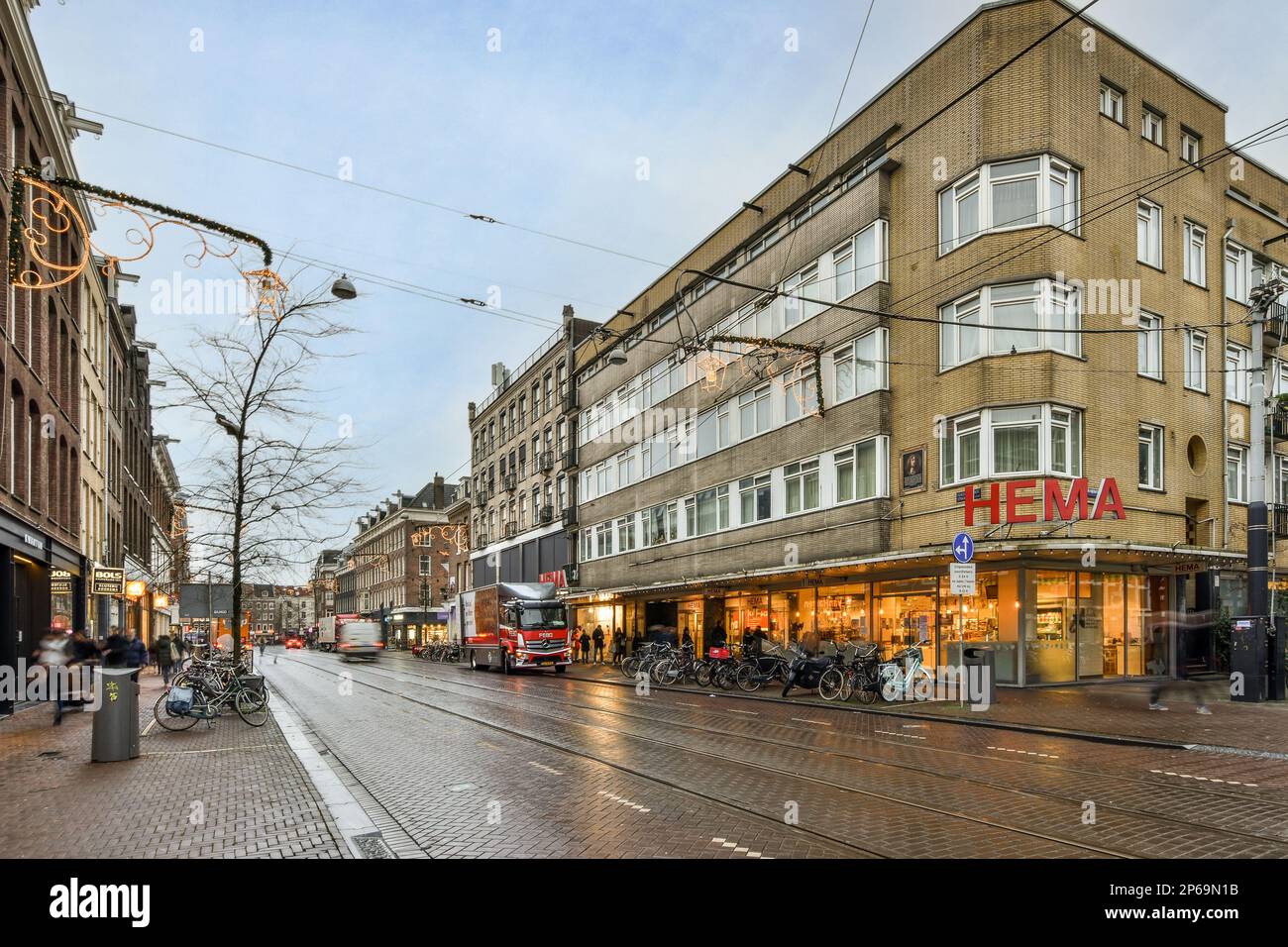 Amsterdam, Netherlands - 10 April, 2021: a city street with people ...