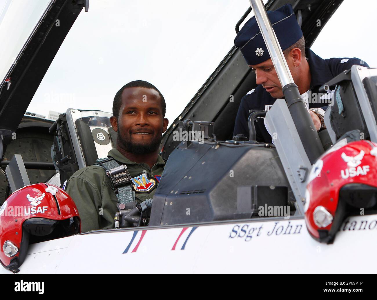 Broncos Cornerback Champ Bailey climbs to the cockpit of a Thunderbirds ...