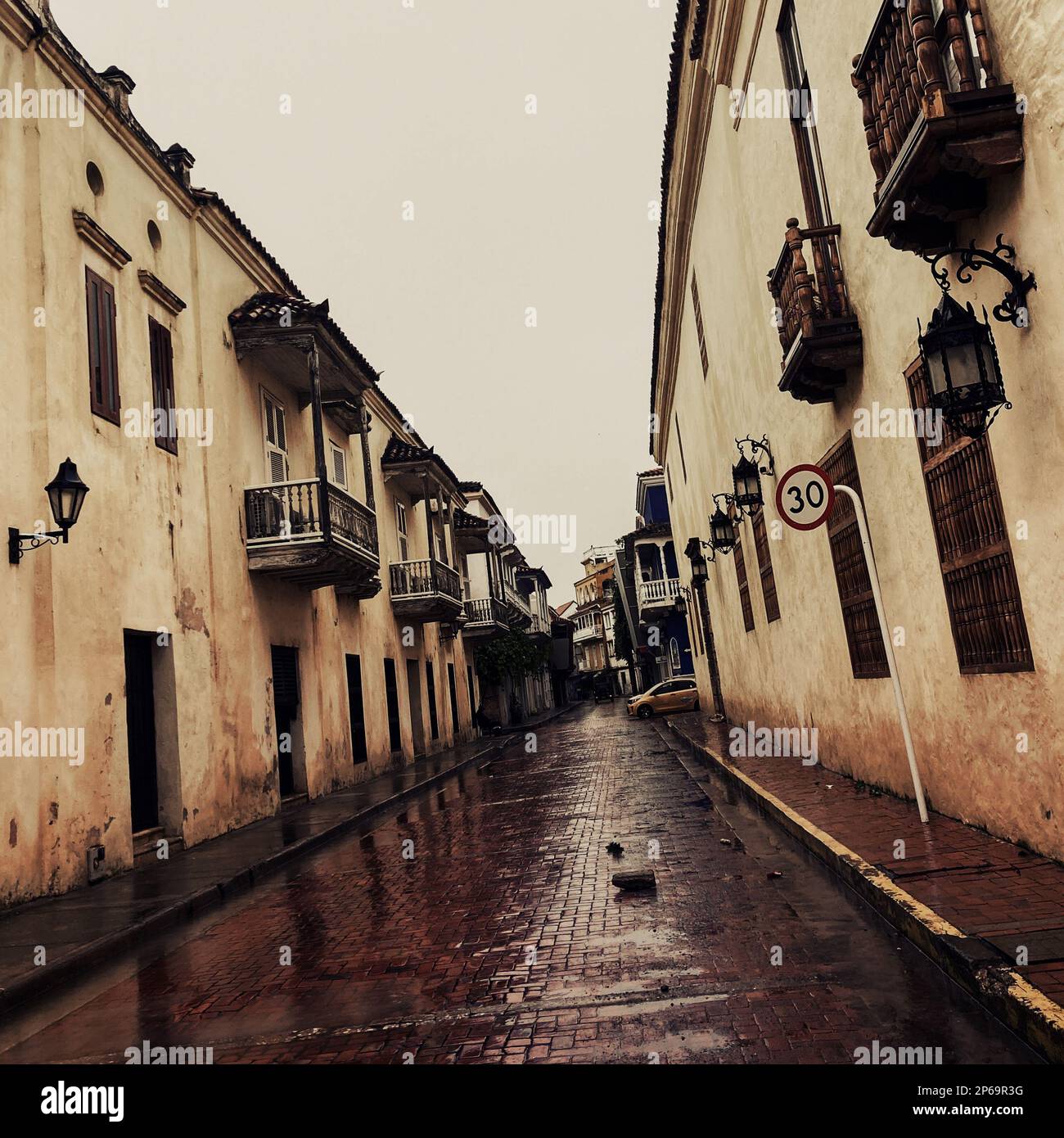 A colonial street in the walled city is seen empty of tourists due to a ...
