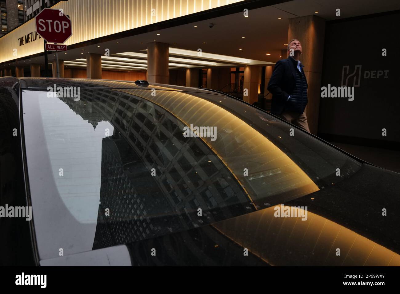 Man walking between buildings hi-res stock photography and images - Alamy