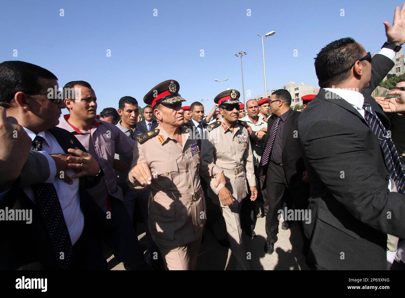 Egyptian Gen. Sami Anan, center, and Field Marshal Hussein Tantawi, who ...