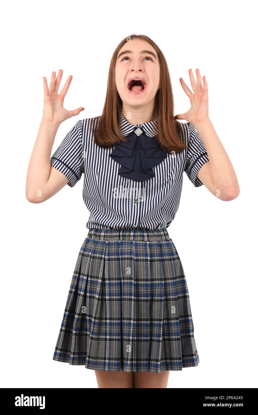 Young beautiful girl in a school uniform on a white background, crazy ...